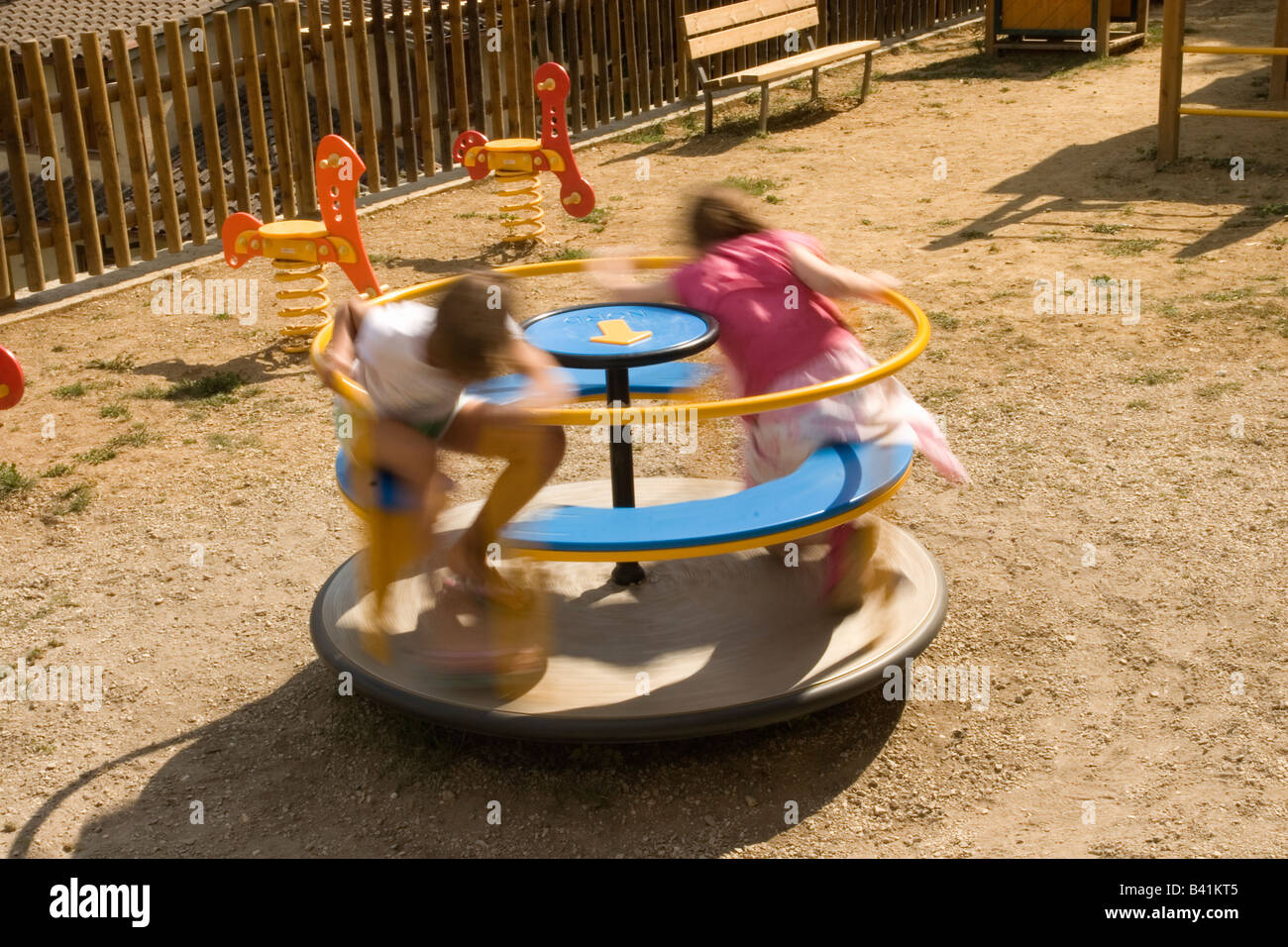 Girls on roundabout hi-res stock photography and images - Alamy