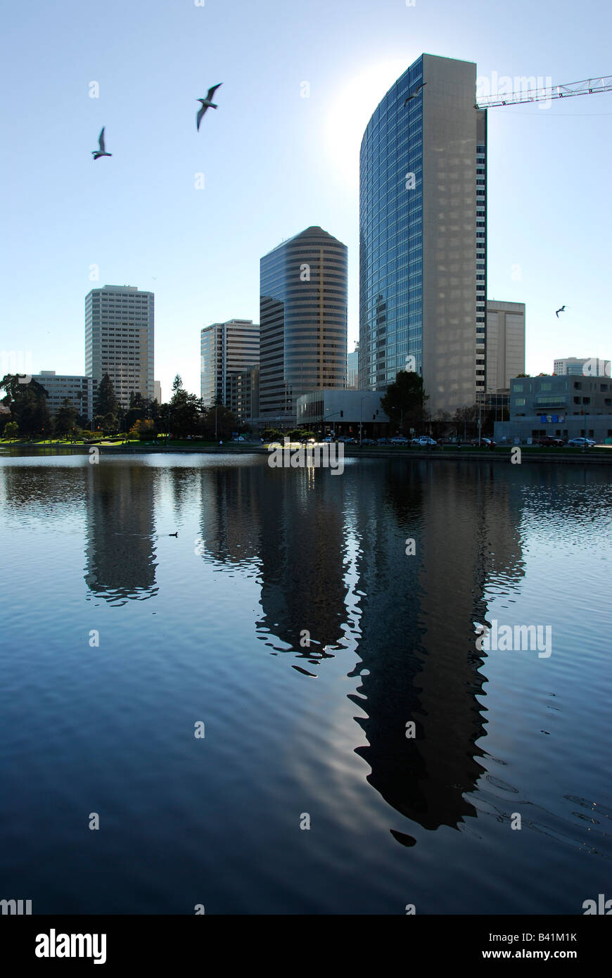 Modern buildings and their reflection on water Stock Photo - Alamy