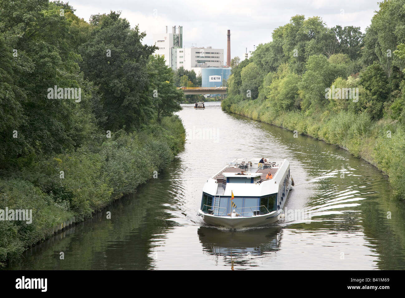 Canal with factory and trees berlin Germany Stock Photo - Alamy