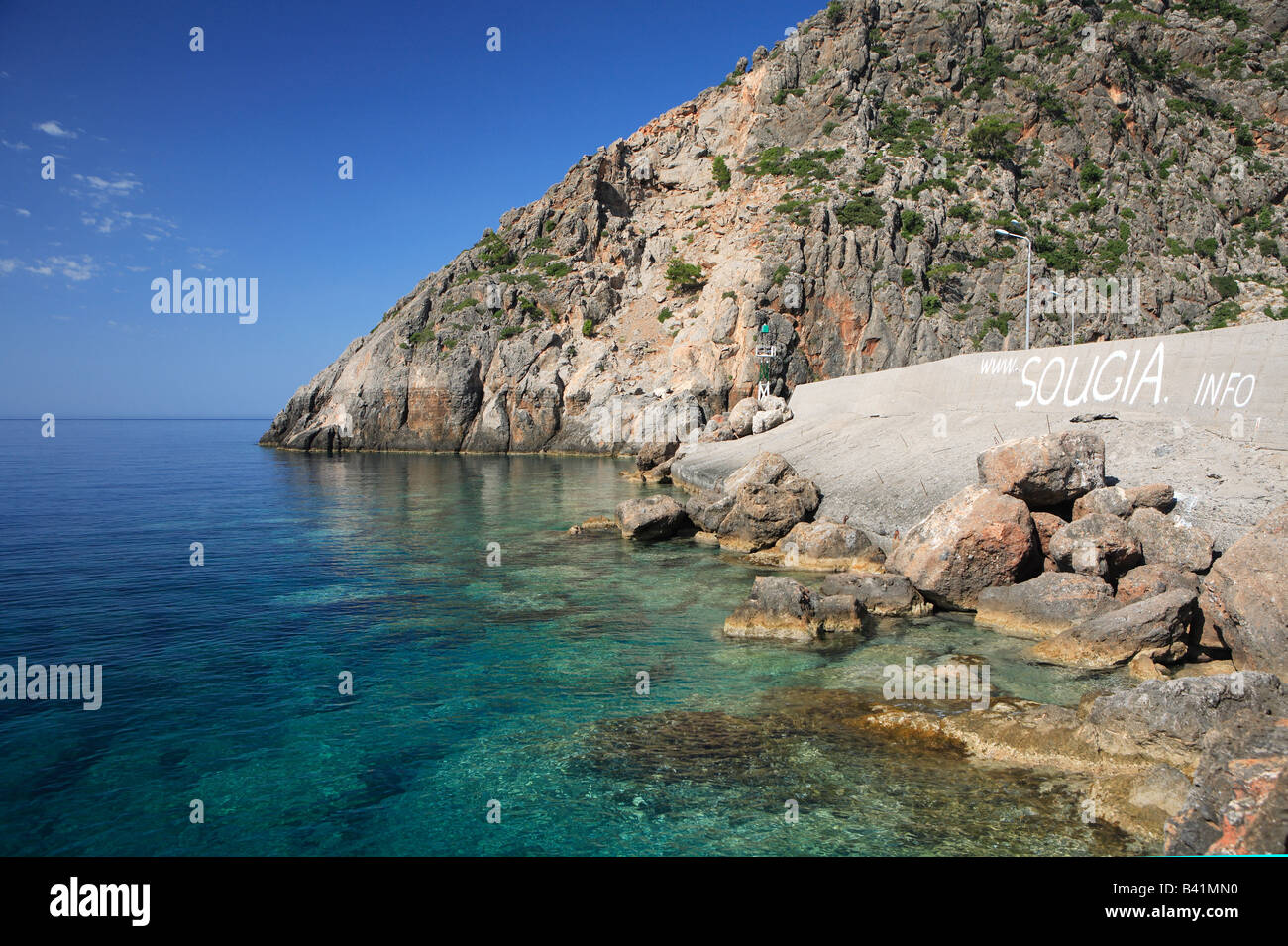 The harbour wall and cliffs at Sougia, south west Crete, showing the ...