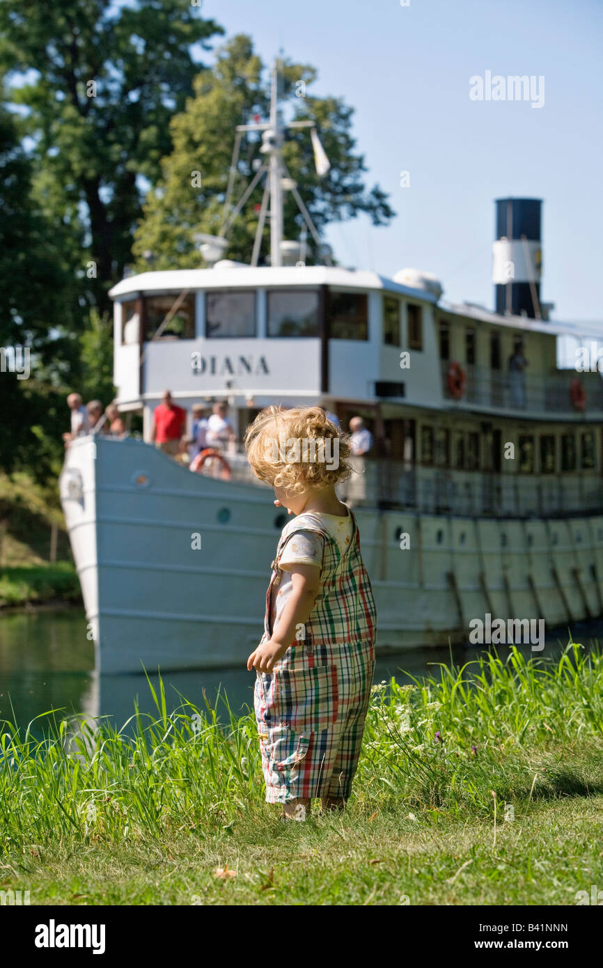 Boy watching boats hi-res stock photography and images - Alamy