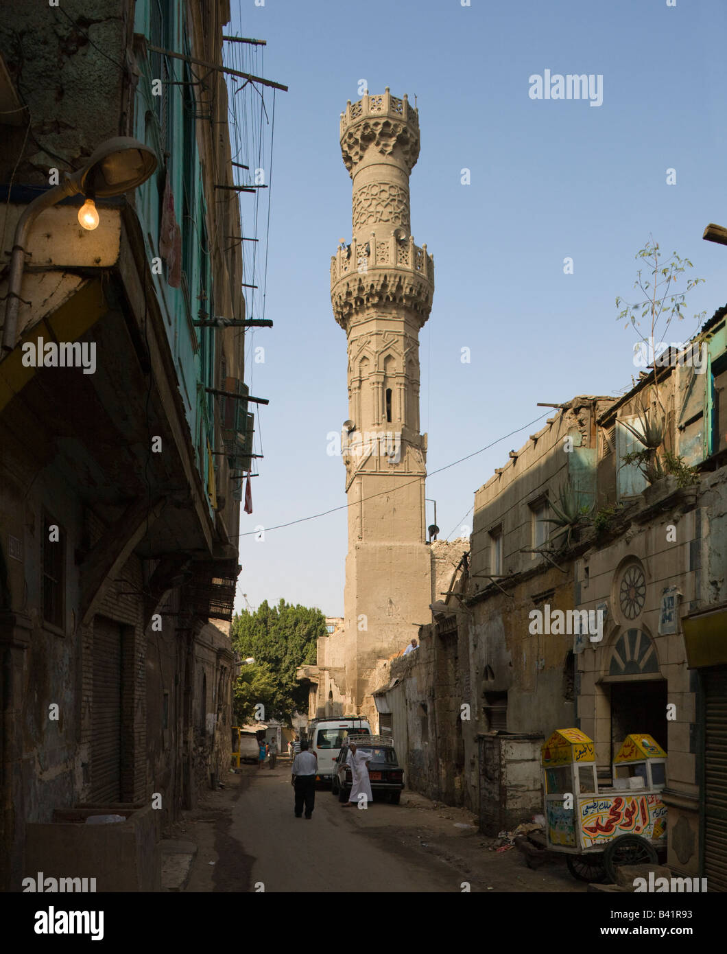 street scene with minaret of Khushqadam al-Ahmadi mosque, Cairo, Egypt ...