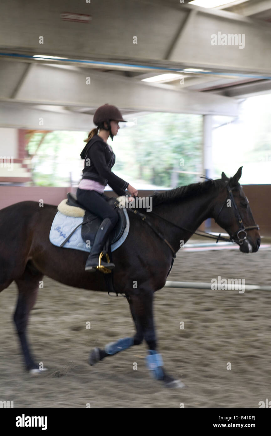 Girl horseback riding lesson Stock Photo - Alamy