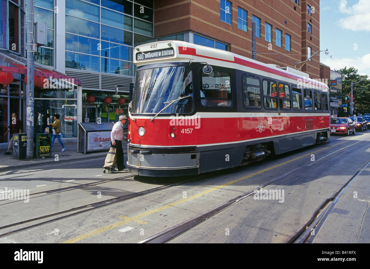 A trolly car tram carries passengers and commuters around the downtown ...