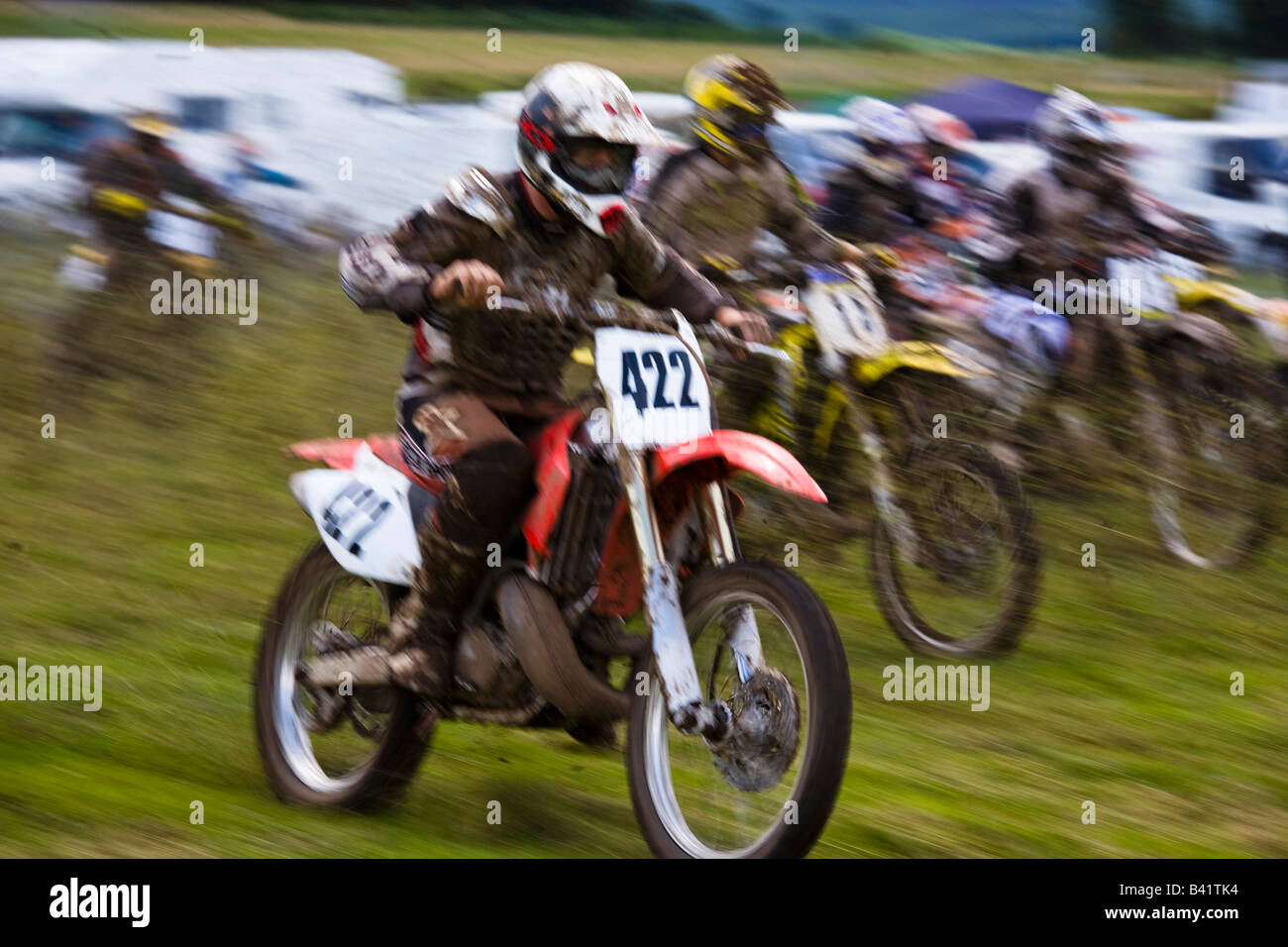 Motocross scrambling at the start with all the motorbike competing for ...