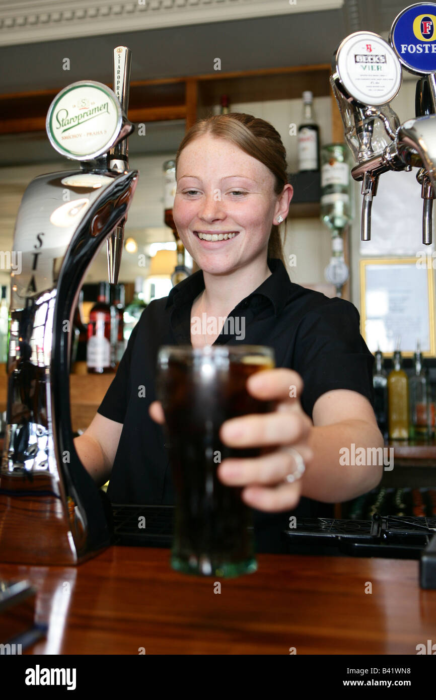Women serving beer in pub Stock Photo - Alamy