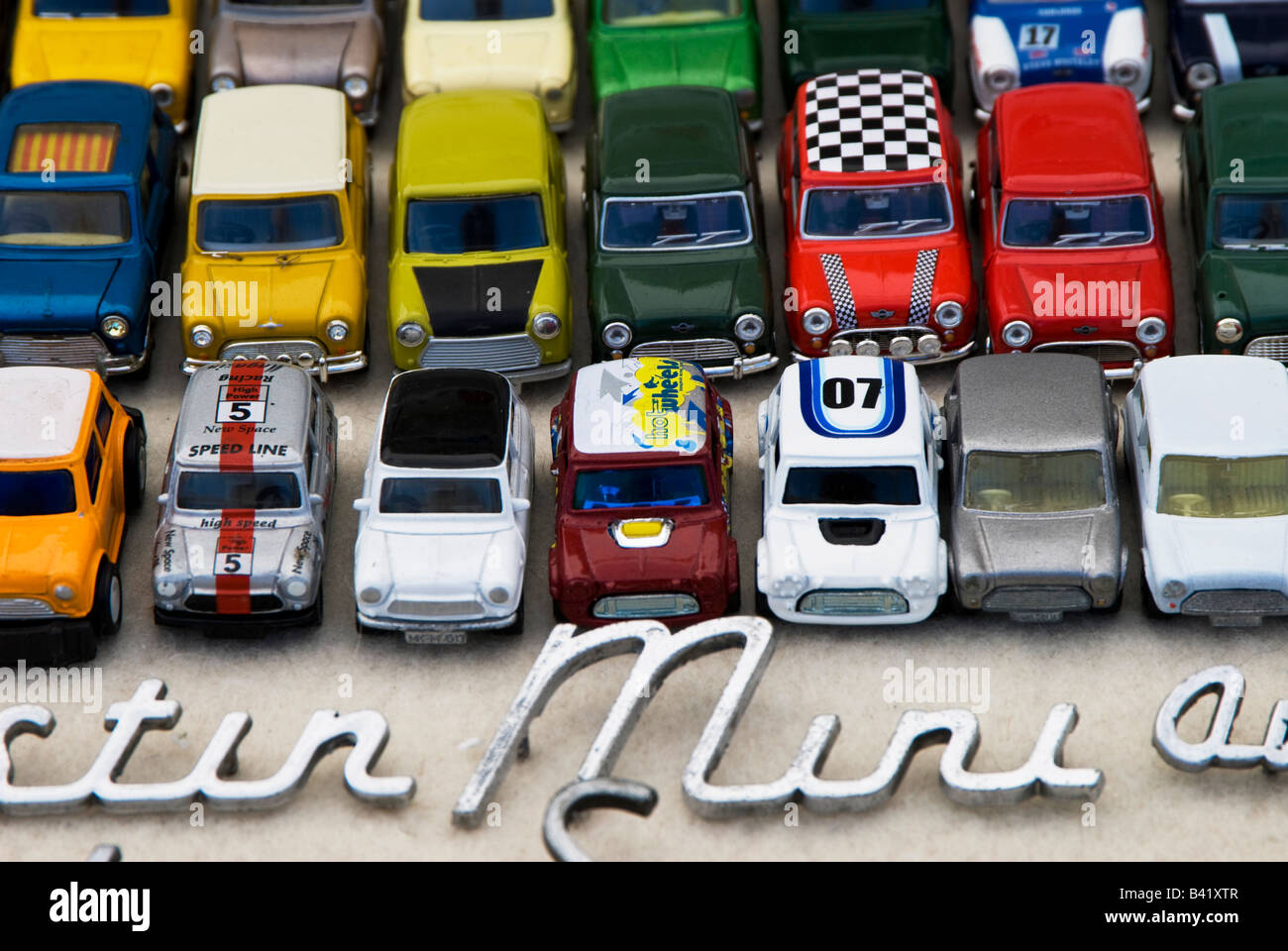 A collectors disply of model Mini motor cars, emblems and insignia ...