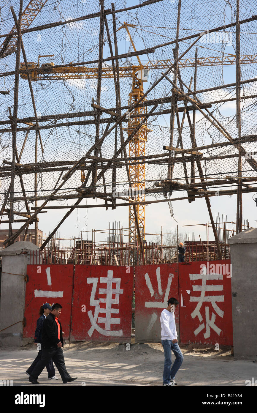 People walking past a construction site, Beijing, China Stock Photo - Alamy