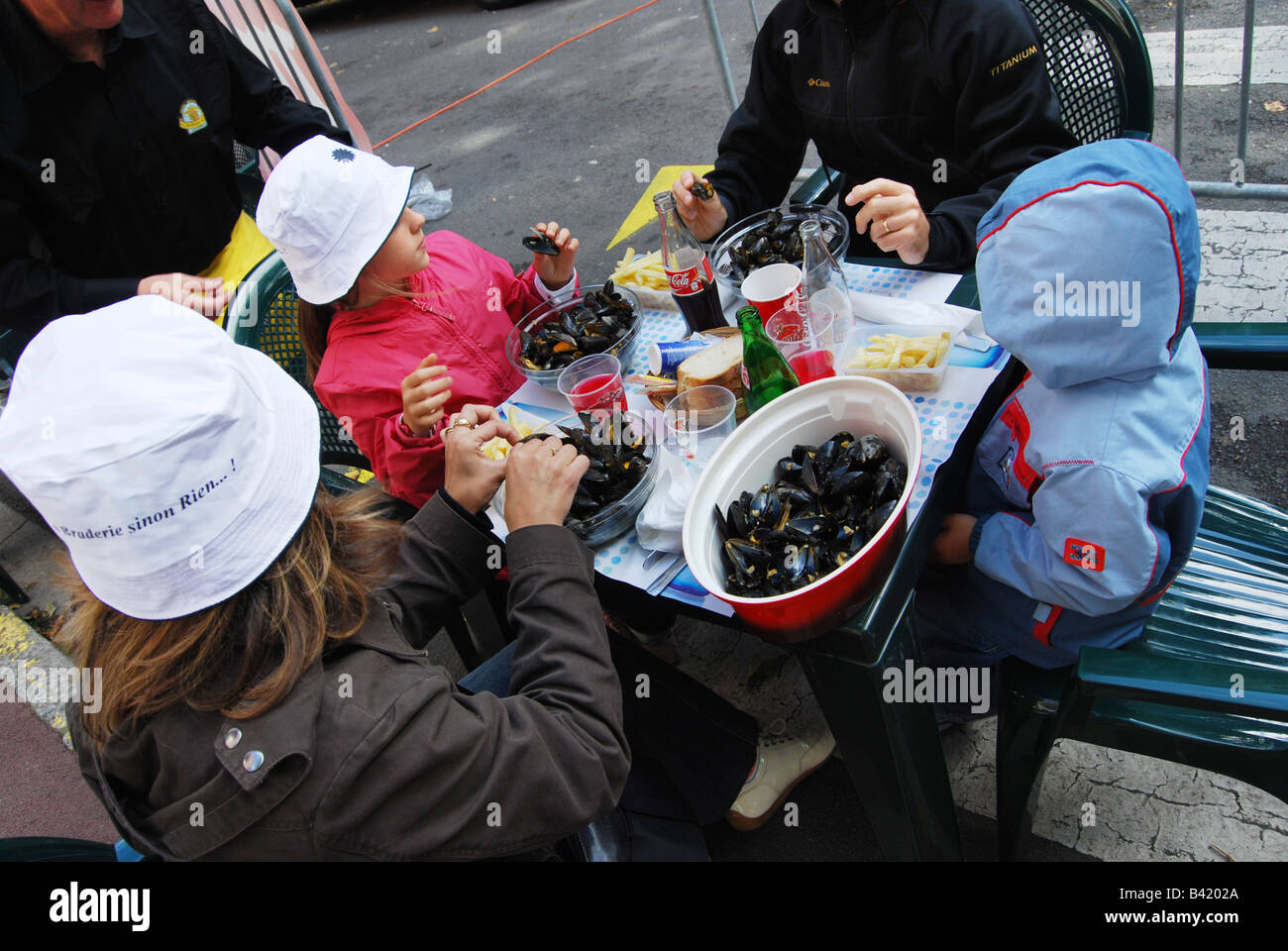 people eating mussels the traditional fare at Lille Braderie France ...