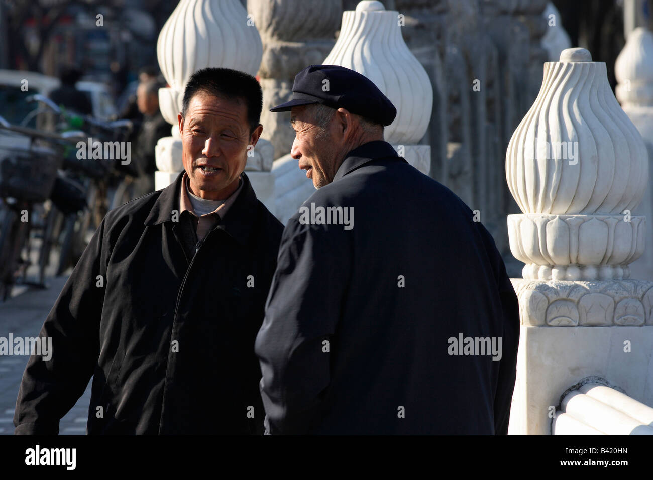 Two old Chinese men talking, Beijing, China Stock Photo - Alamy