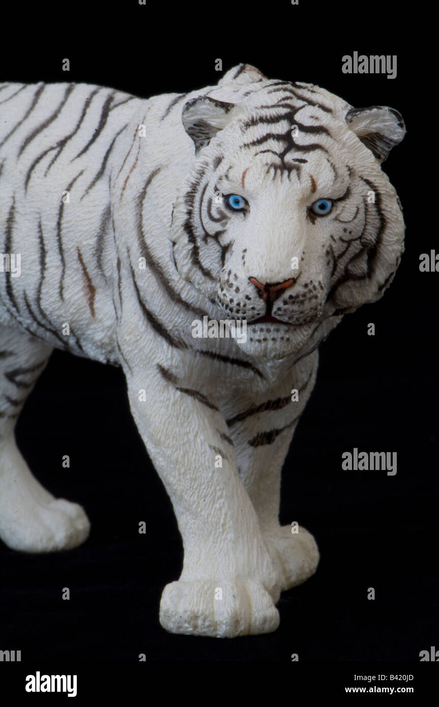 Toy figure of a white tiger Stock Photo - Alamy