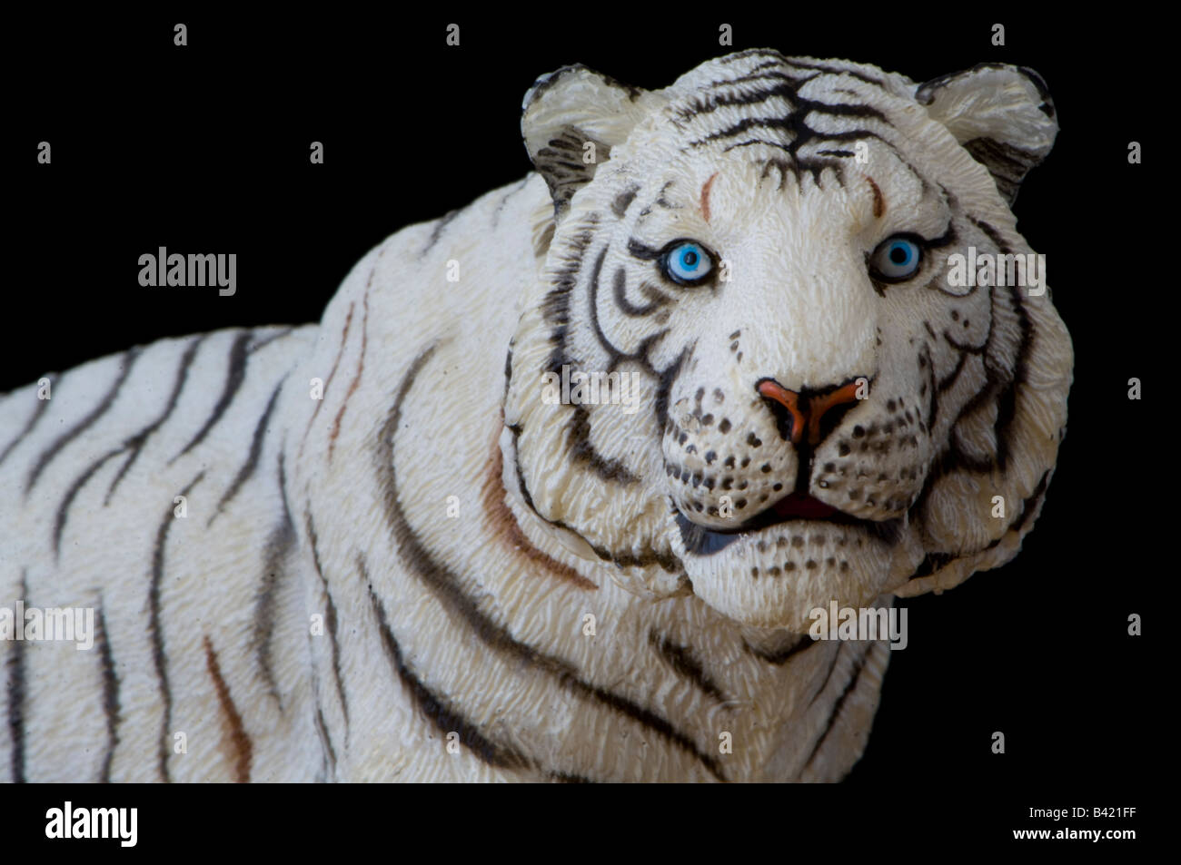 Toy figure of a white tiger Stock Photo - Alamy