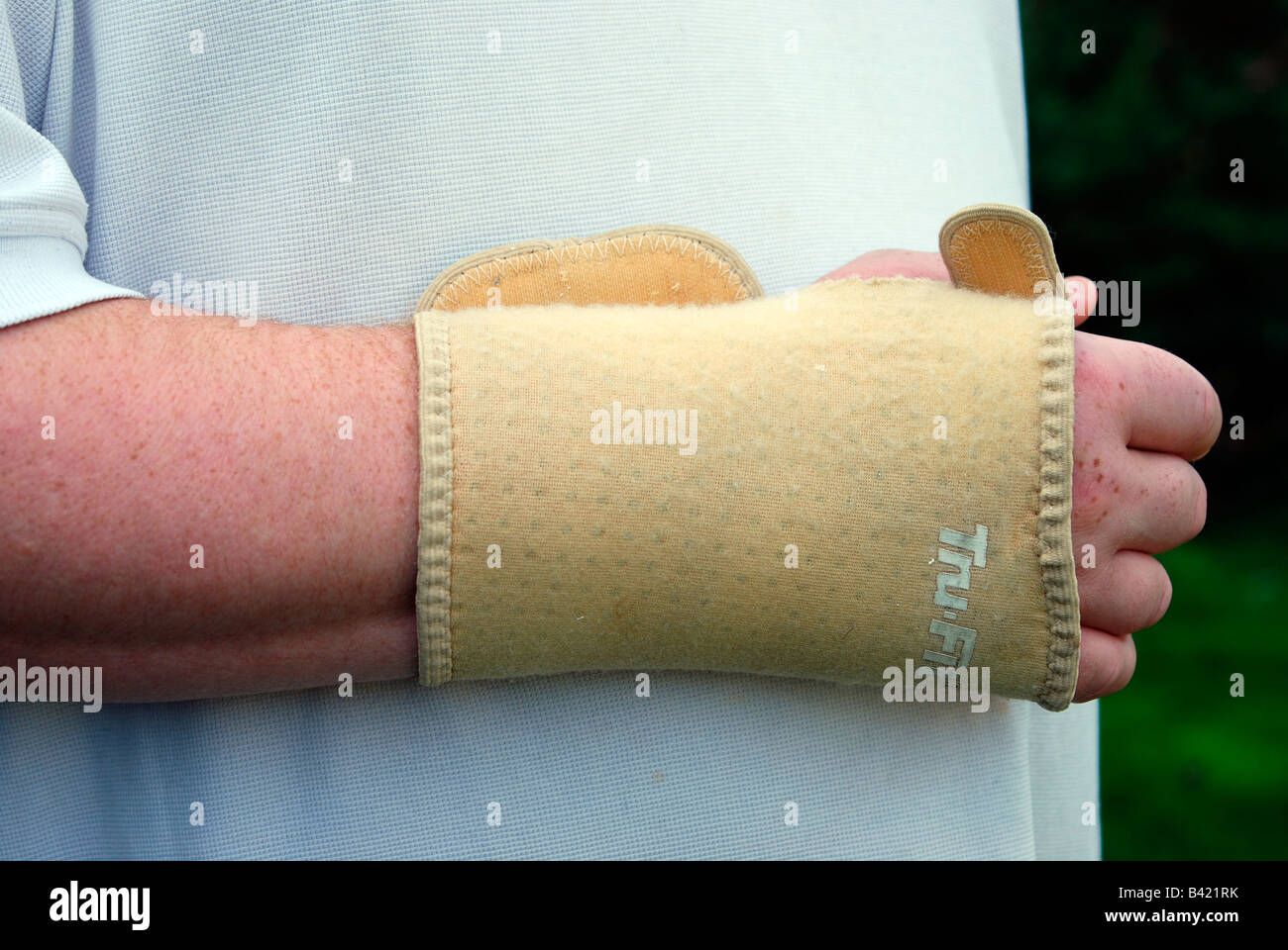 man wearing a wrist support suffering from a sprain Stock Photo - Alamy