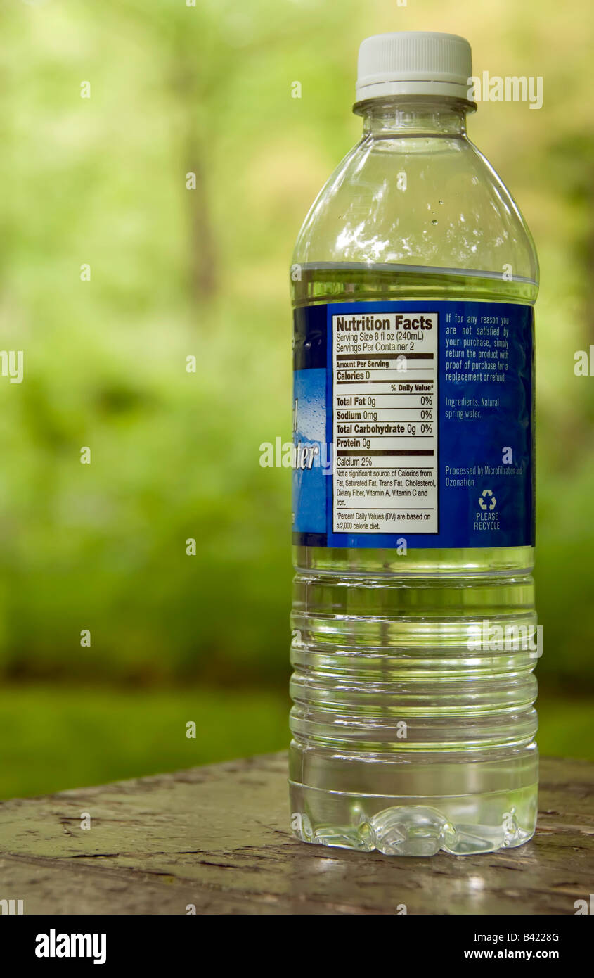 Bottled water near corner of picnic table with focus on label Stock ...