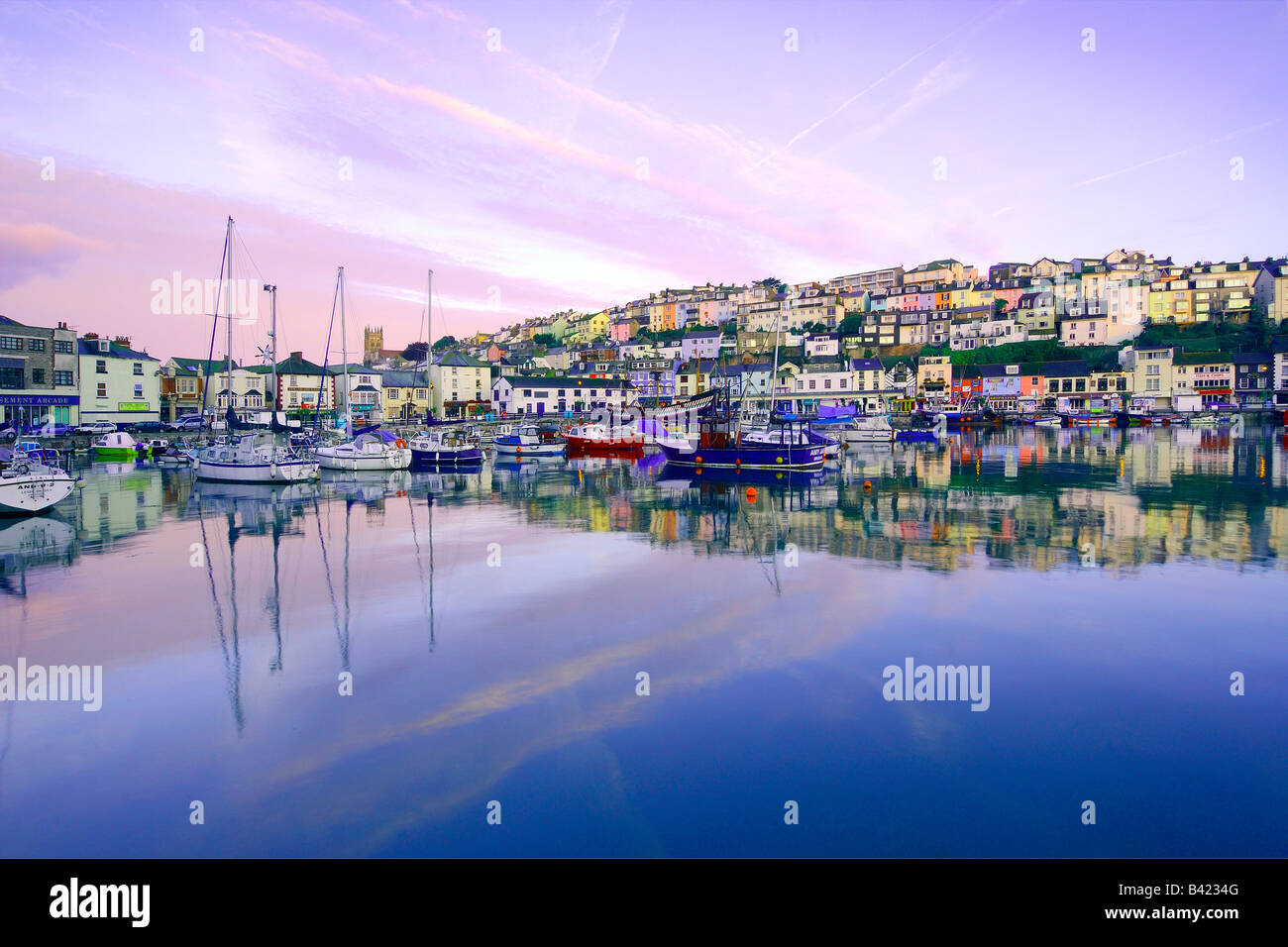 The small fishing town of Brixham on the South Devon coast at sunrise ...