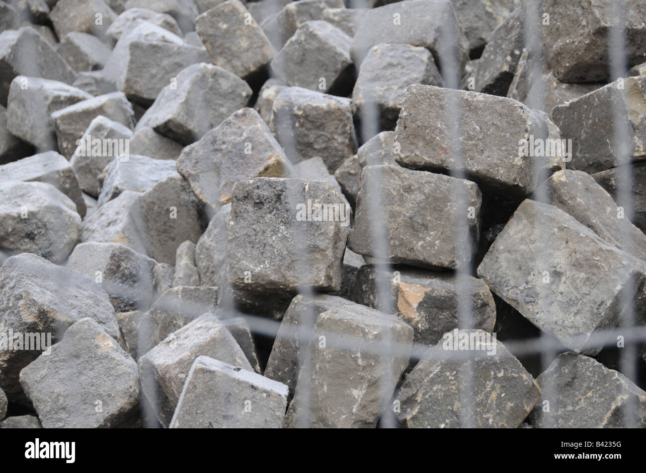 Close up Stone setts used for paving and construction Stock Photo - Alamy