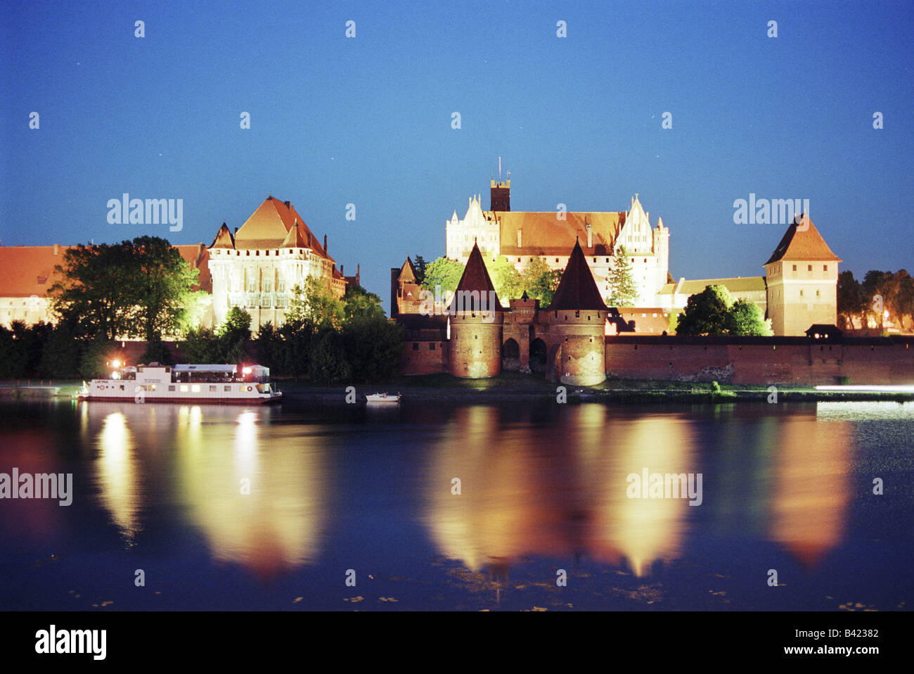 Malbork Castle on the Nogat River in the evening, Poland Stock Photo ...