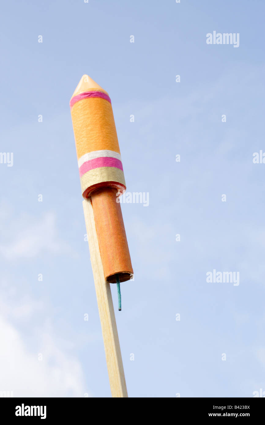 striped rocket and blue sky Stock Photo - Alamy