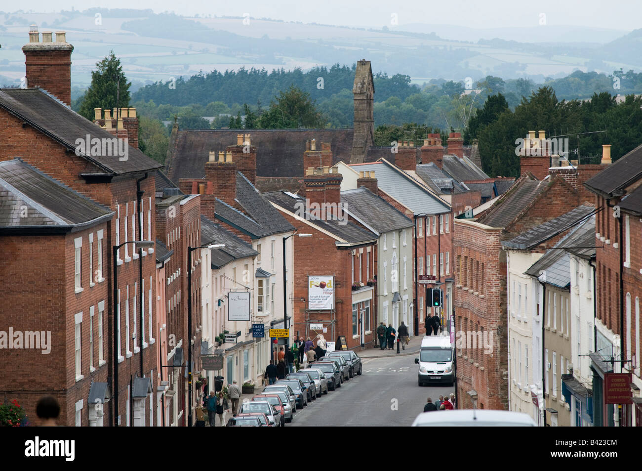 Terraces of red brick buildings on street in Ludlow Shopshire England ...