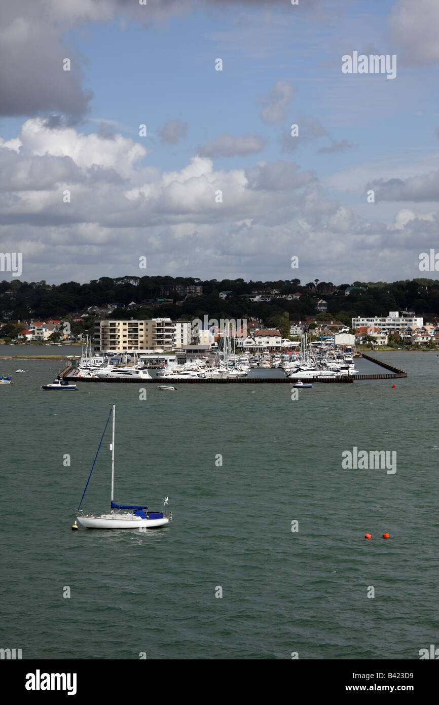 A yacht sailing in Poole harbour in Dorset in England Stock Photo - Alamy