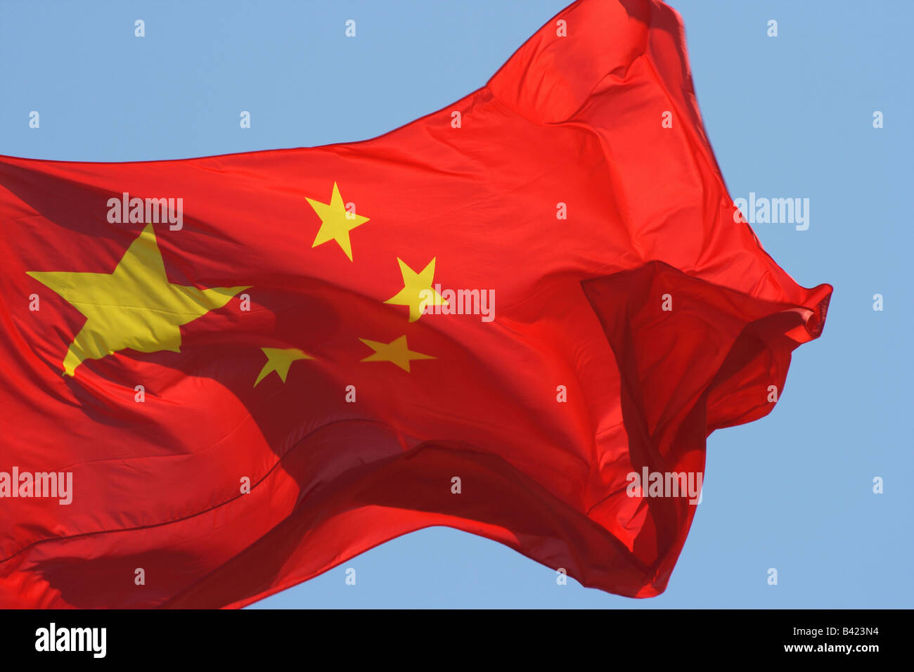 Chinese national flag against blue sky Stock Photo - Alamy