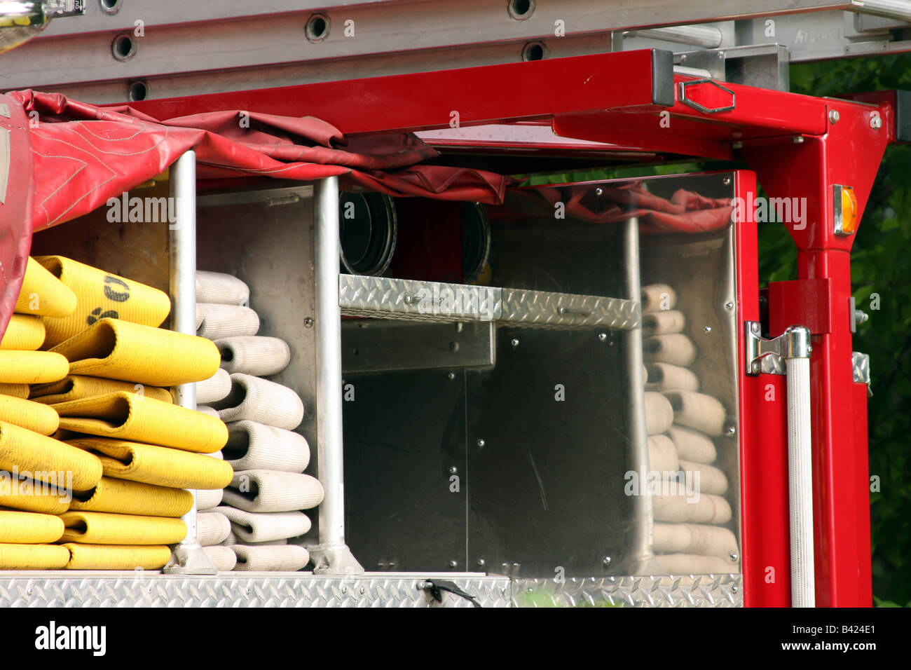 The back of a fire engine where the waterline hoses are kept ready to ...