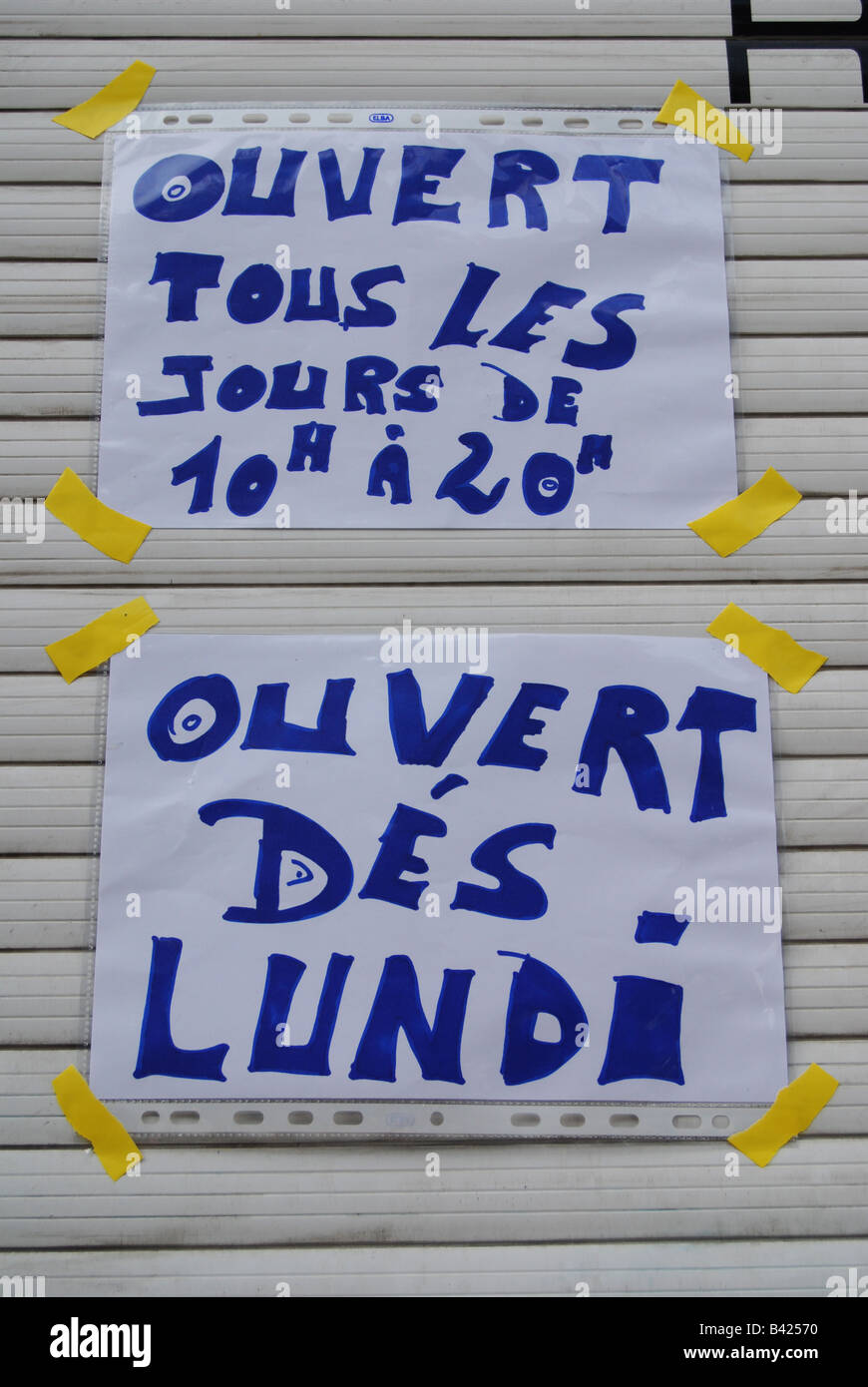 sign indicating business hours outside French shop Stock Photo - Alamy