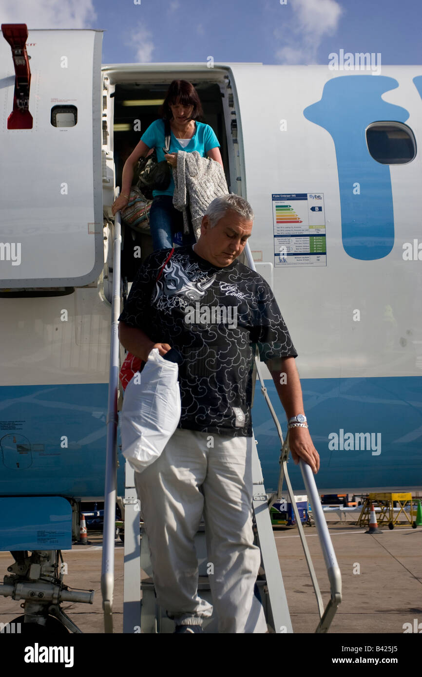 Passengers disembarking on arrival at Manchester International Airport ...