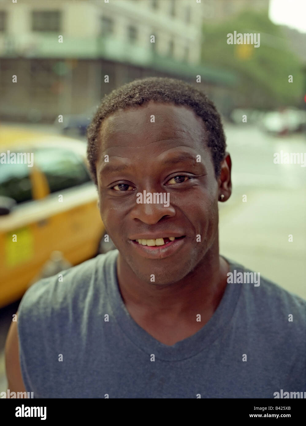 A smiling man on the street in New York Stock Photo - Alamy