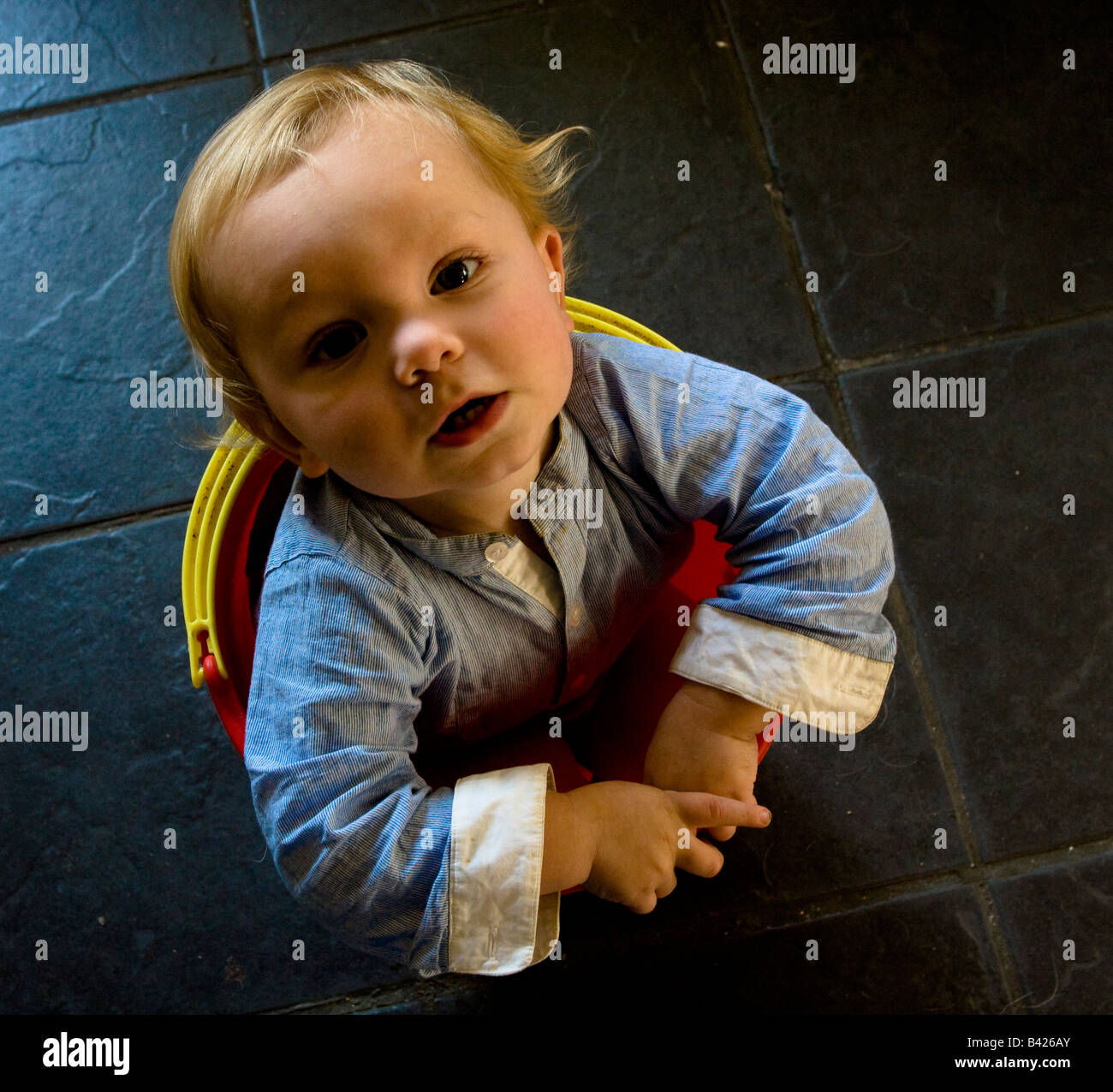 A toddler in a bucket Stock Photo - Alamy