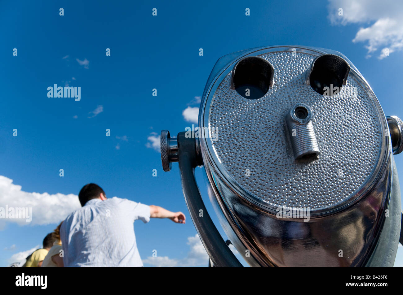 A face on the front of an observation scope Stock Photo - Alamy