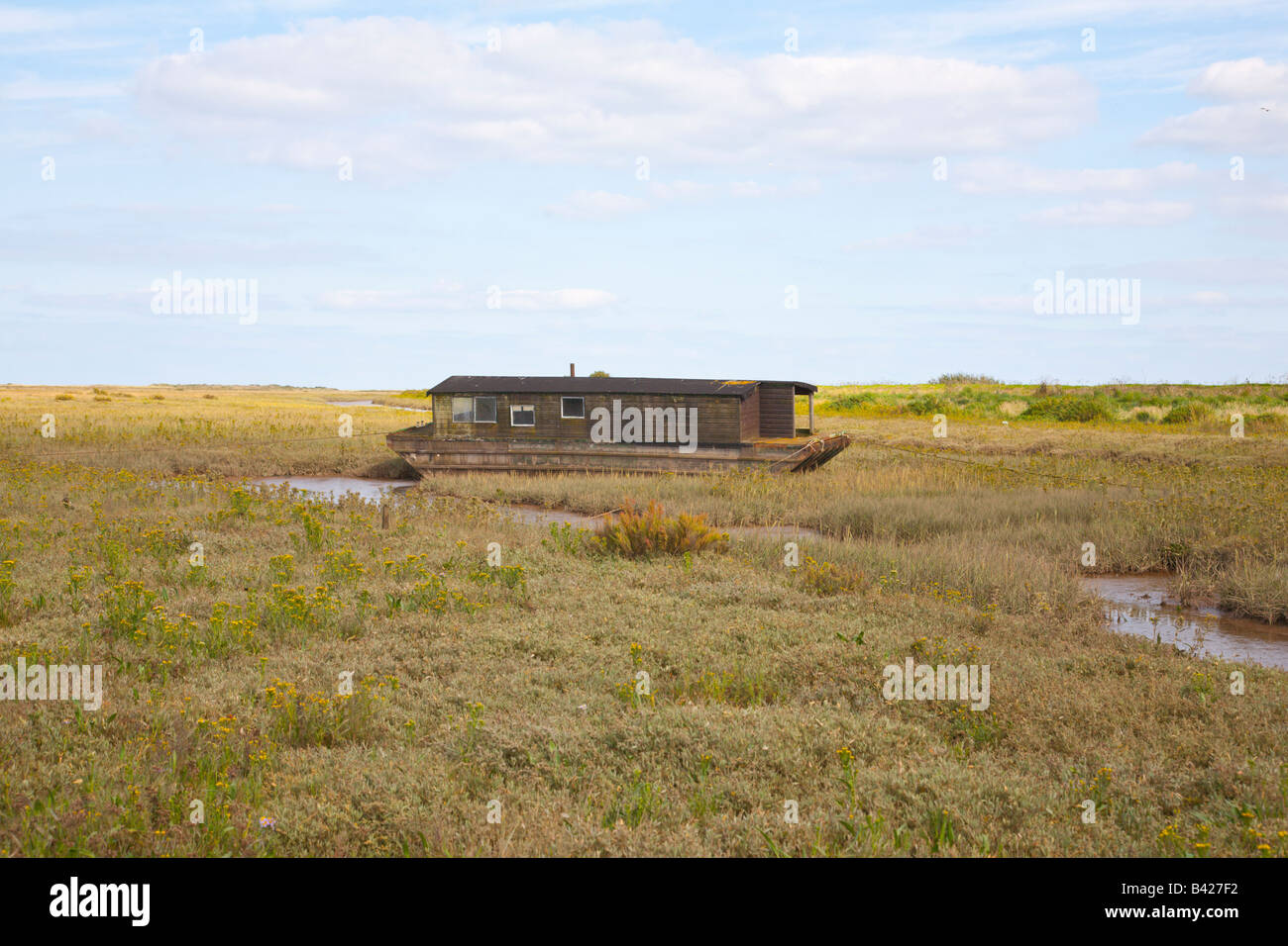 Old houseboat on Burnham Deepdale marshes, Norfolk, England, UK Stock ...