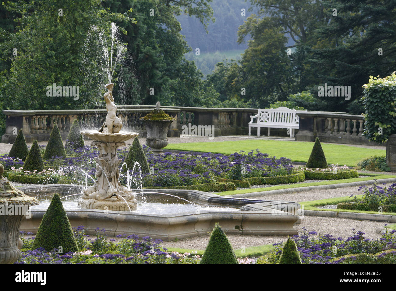 Harewood House garden with topiary, balustrade and fountain Stock Photo ...