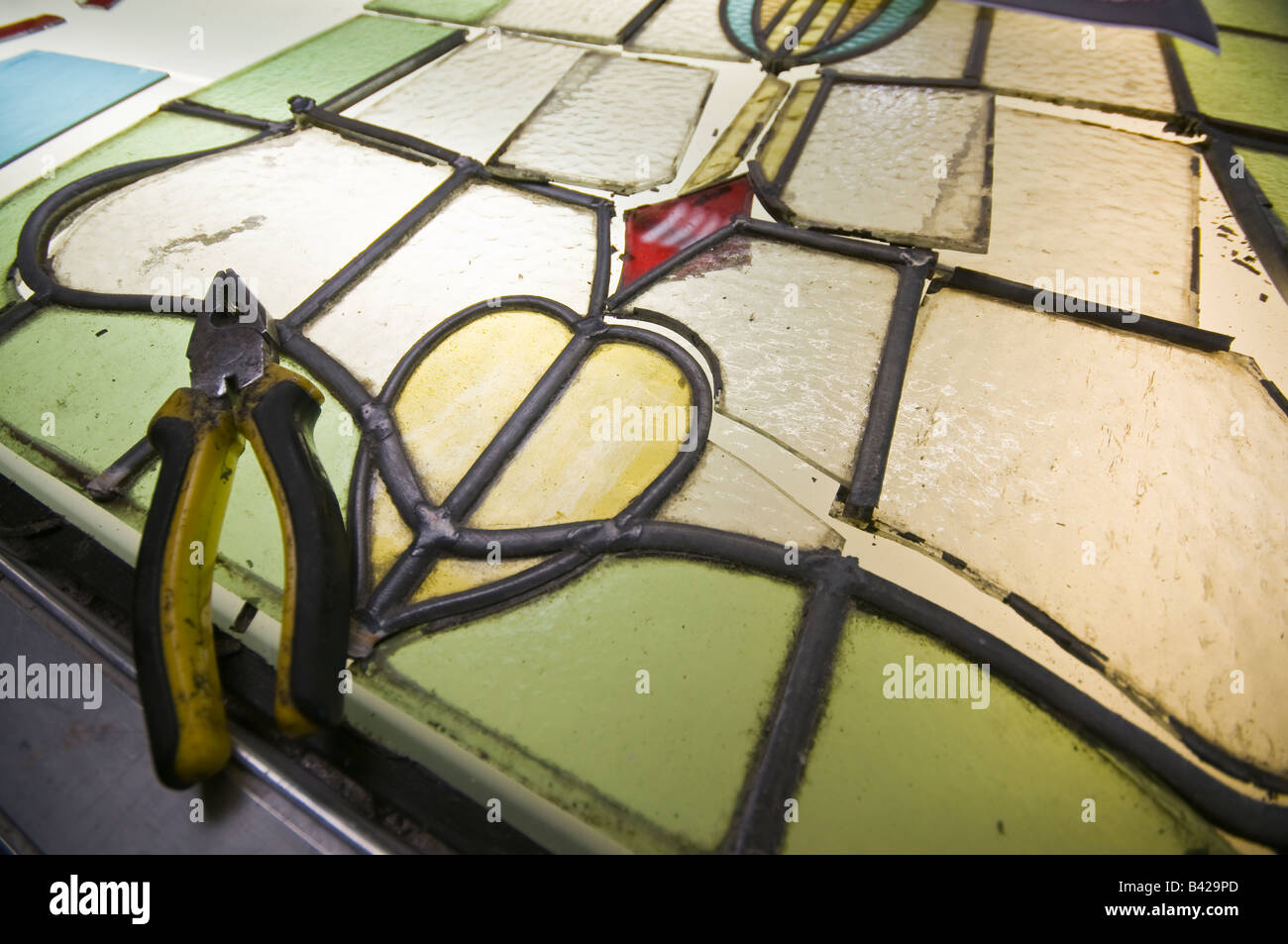 Restoring an old stained glass church window Stock Photo - Alamy