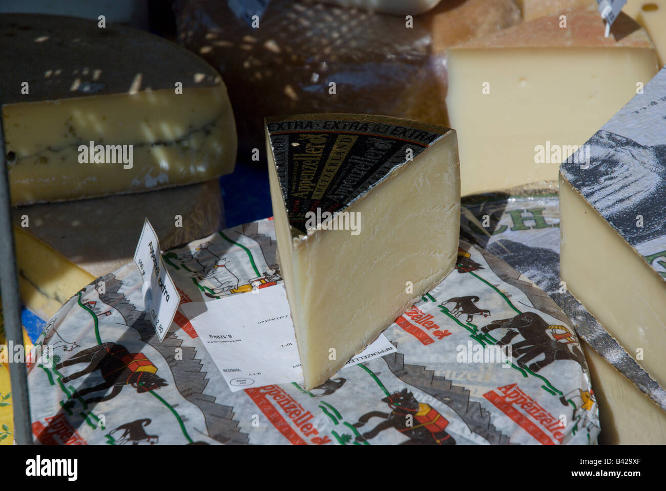 Traditional Swiss cheese sitting on a table at the Saturday farmer s ...