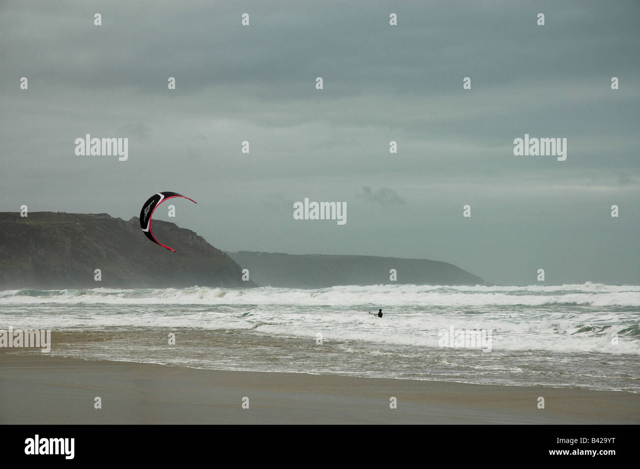 A para surfer at Perranporth beach Cornwall in December Stock Photo - Alamy