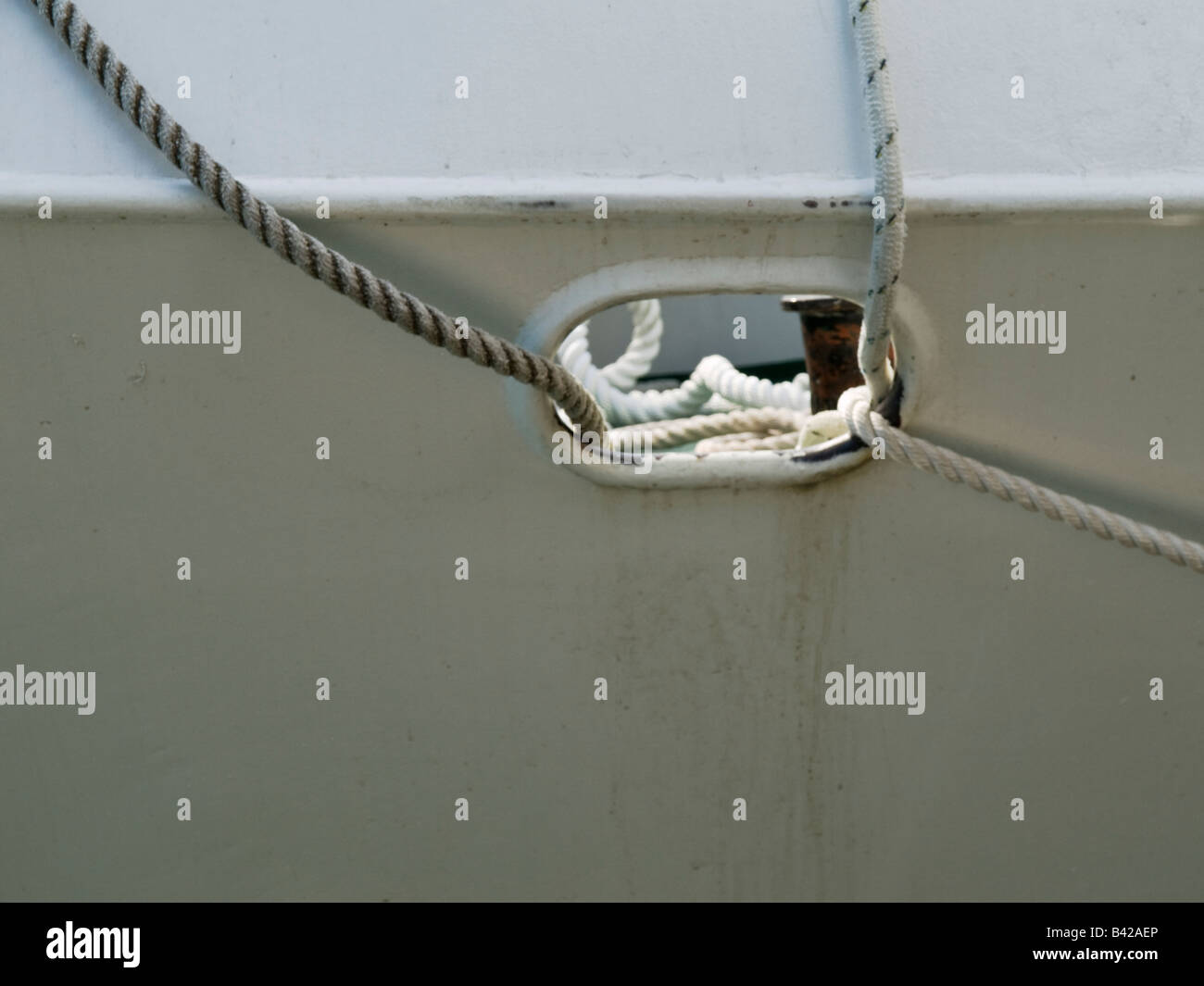 Anchor ropes and anchor opening Stock Photo - Alamy