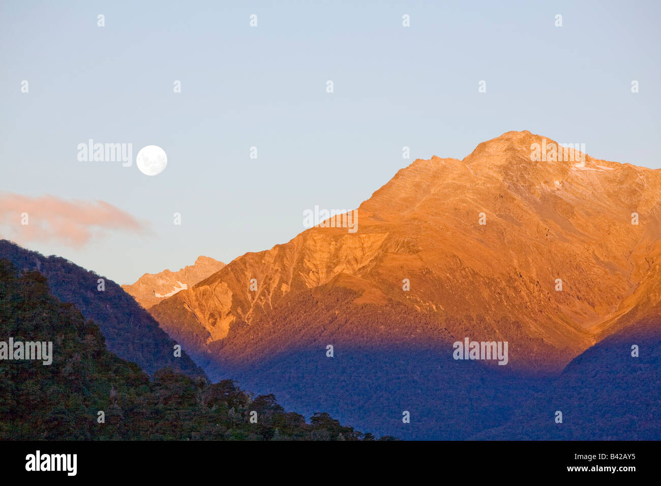 moon rising over new zealand mountains Stock Photo - Alamy