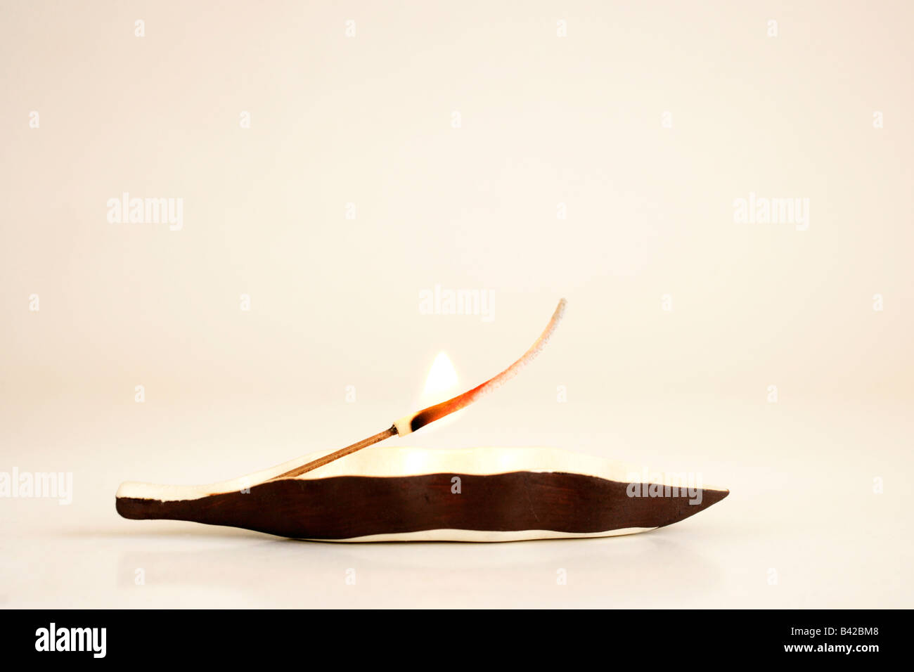 A lit incense stick Stock Photo - Alamy