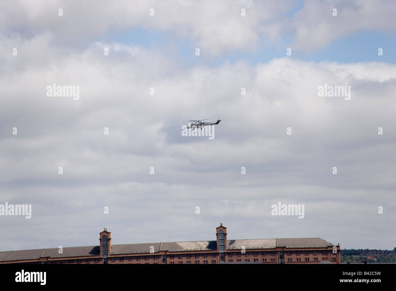 Royal Navy Lynx Helicopter flying over Liverpool and the Mersey River ...