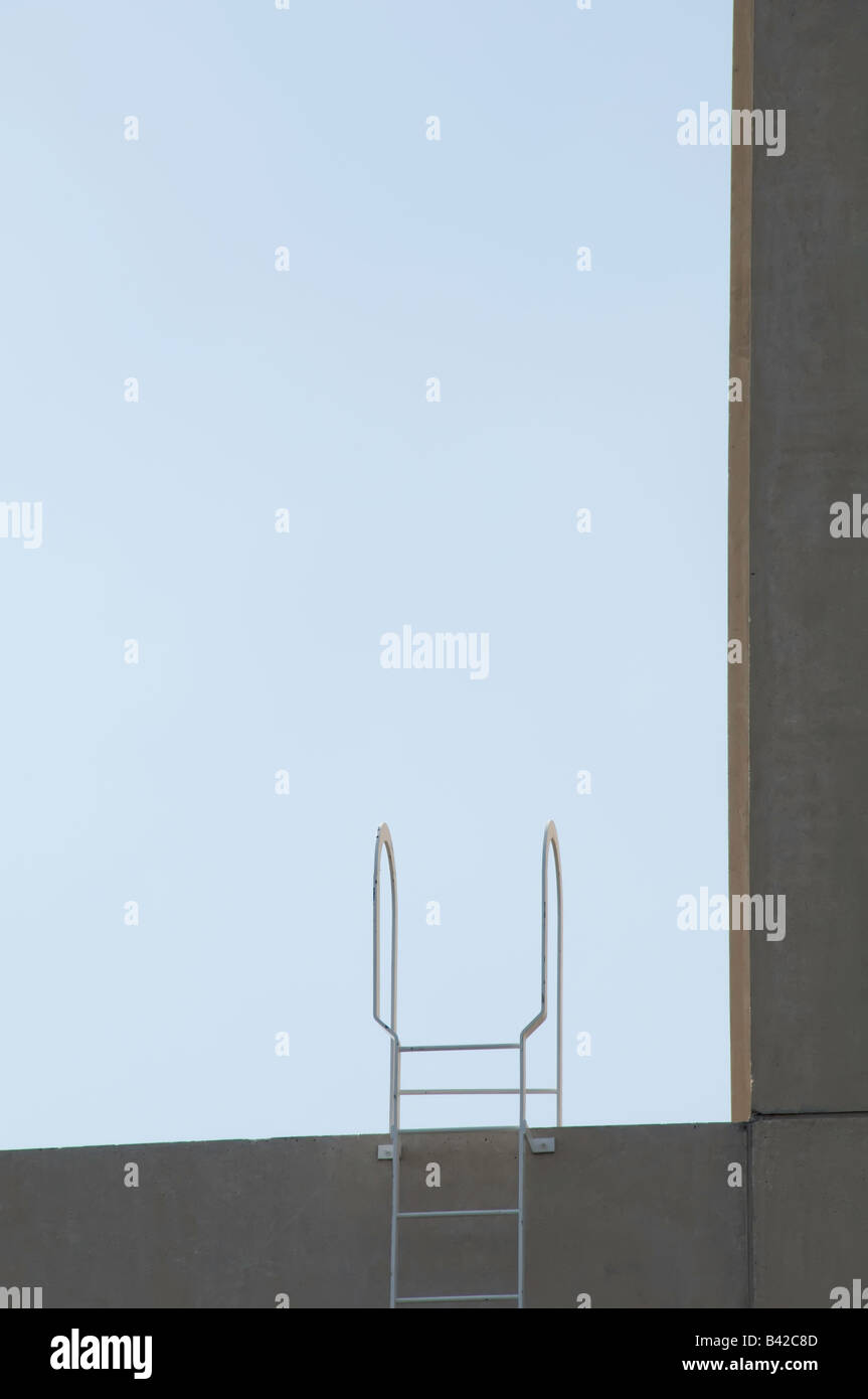 Ladder to lower roof of building Stock Photo - Alamy