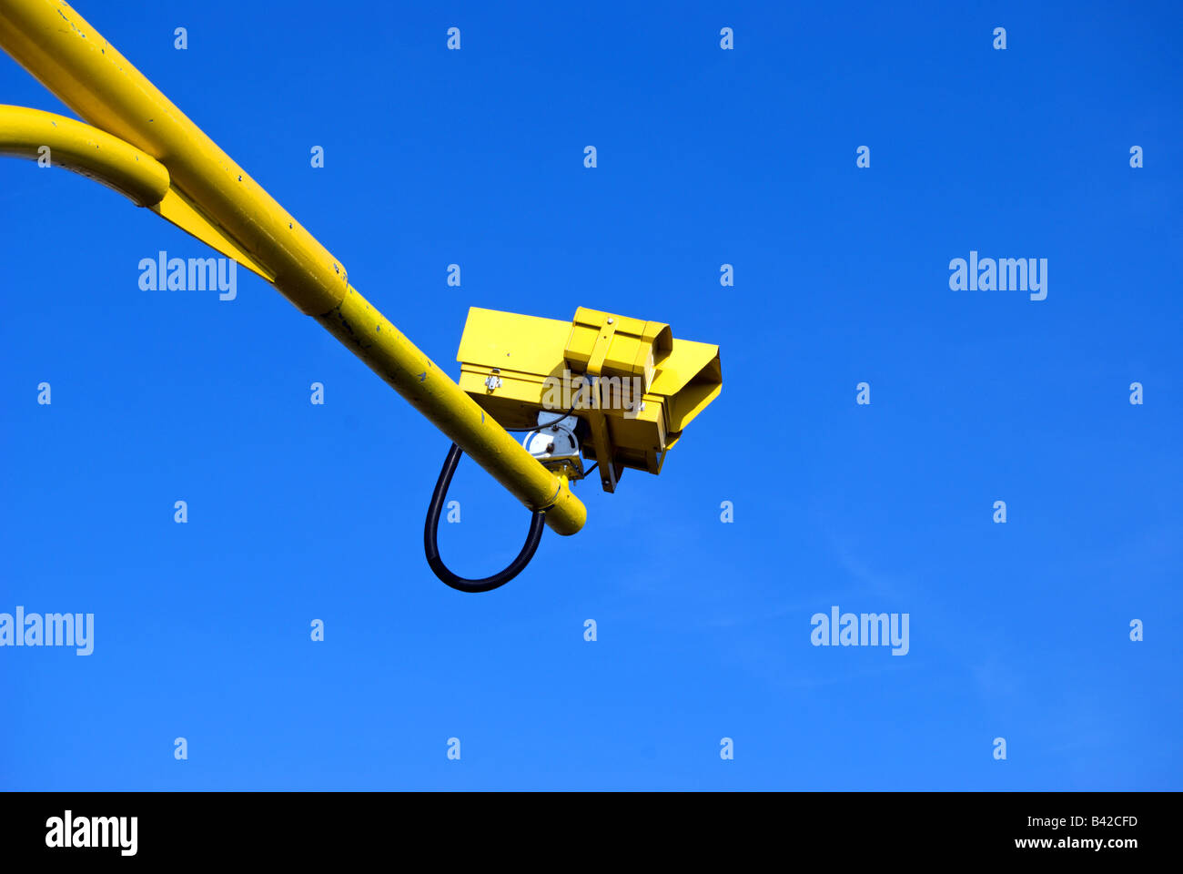 cctv camera in a yellow casing on a yellow pole above the A316 dual ...