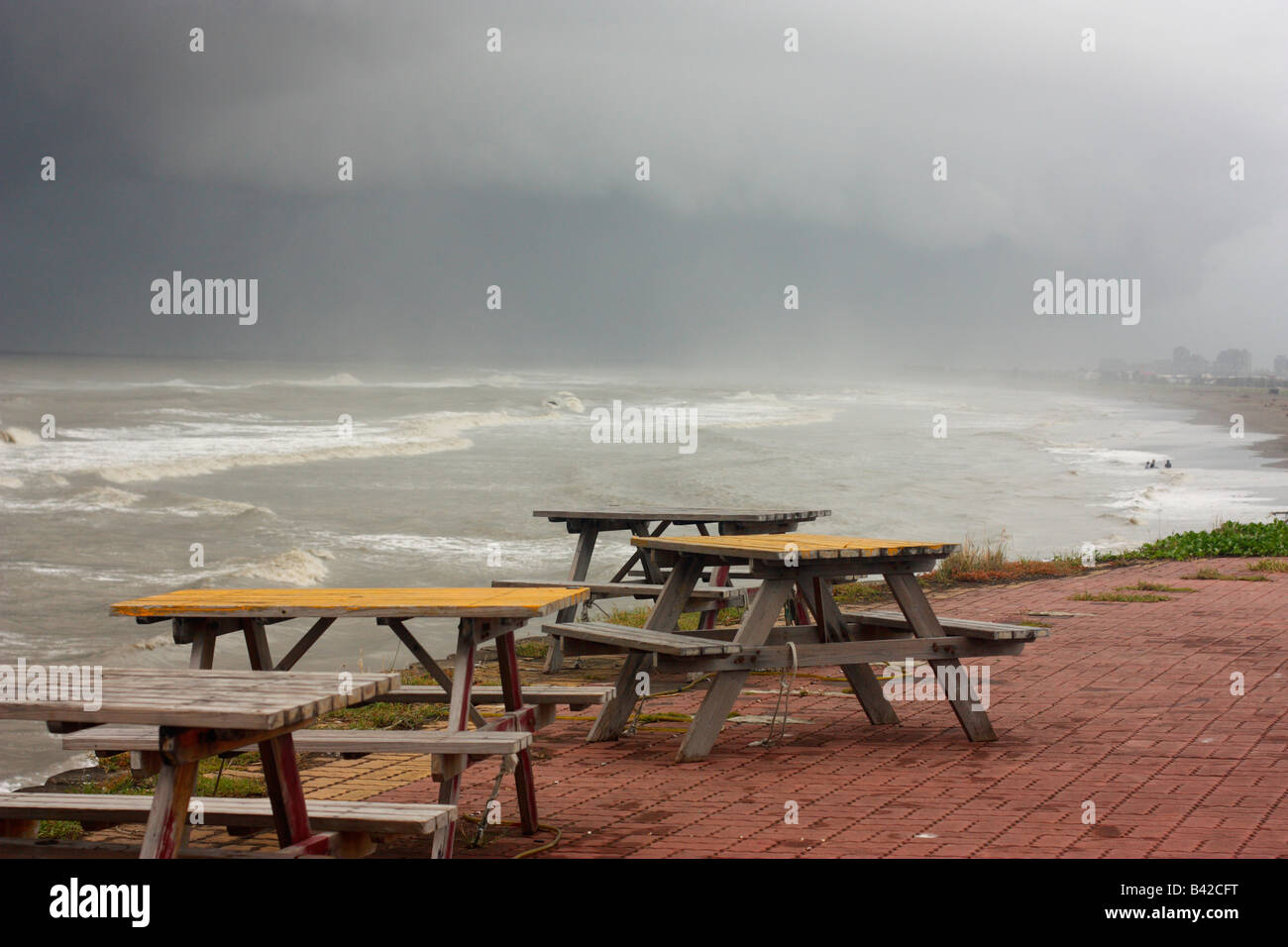 Weather front approaching a deserted beach eating area Stock Photo - Alamy