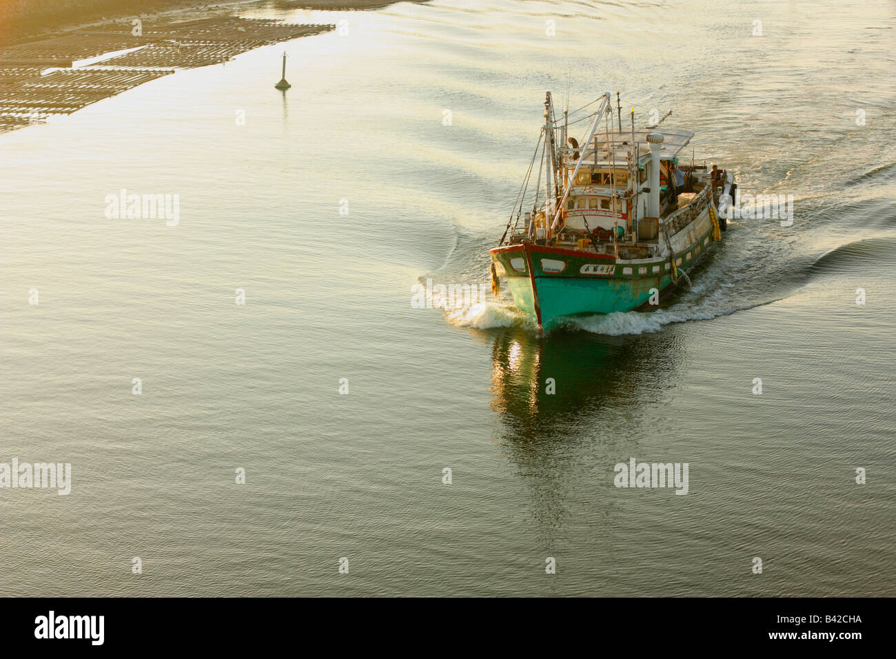 A fishing boat leaves AnPing Harbor. Tainan, Taiwan Stock Photo - Alamy