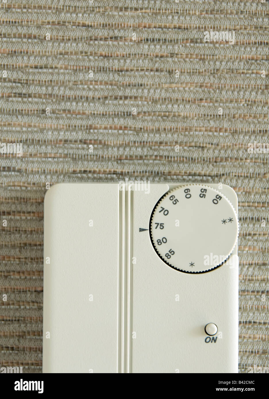 Office thermostat set at 76 degrees Fahrenheit Stock Photo - Alamy