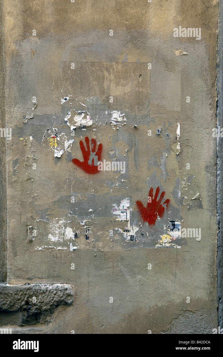 graffiti of two red hands on wall in central bergamo, italy Stock Photo ...