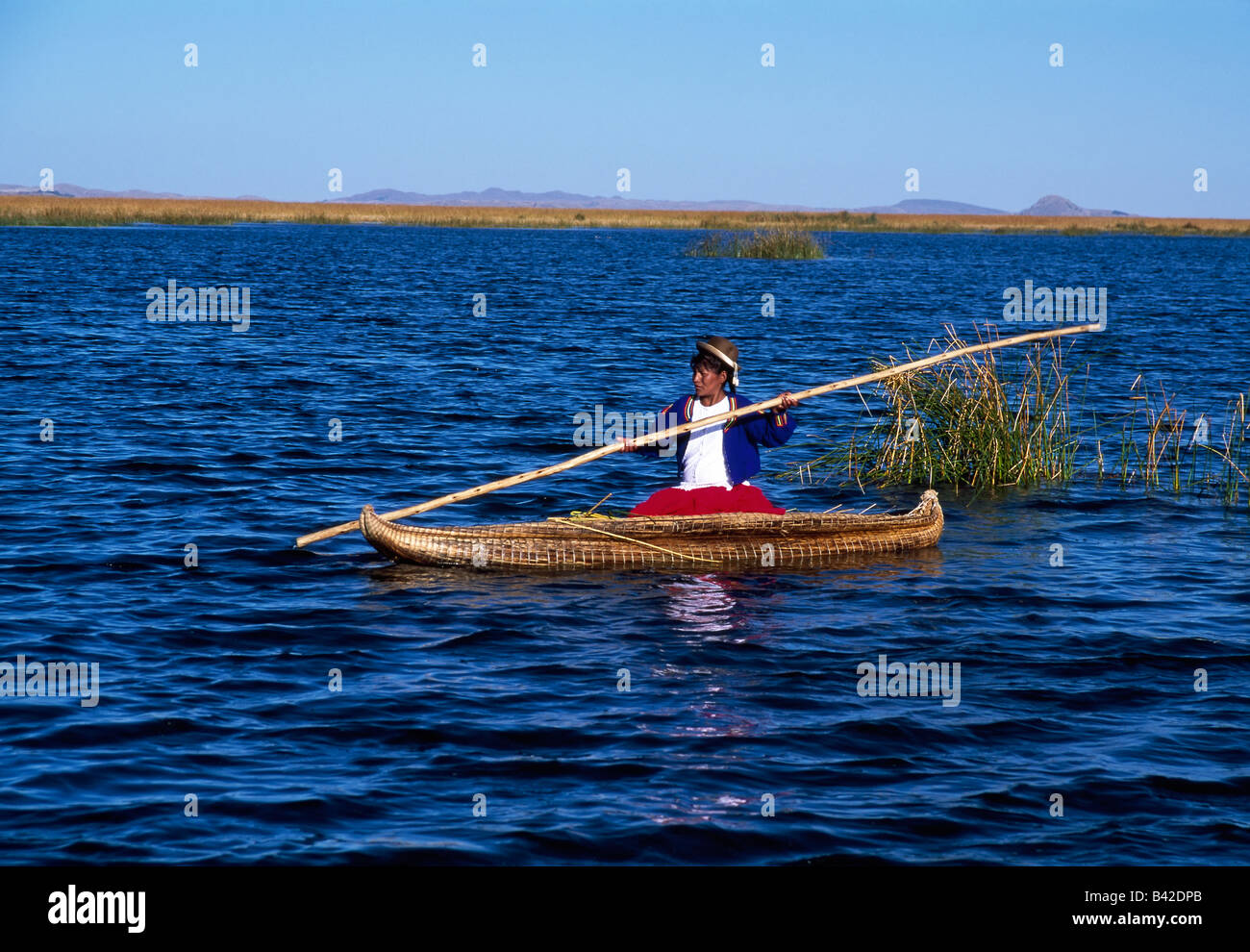 South America, Peru, Lake Titicaca, Islas Flotantes, Uros Indian woman ...