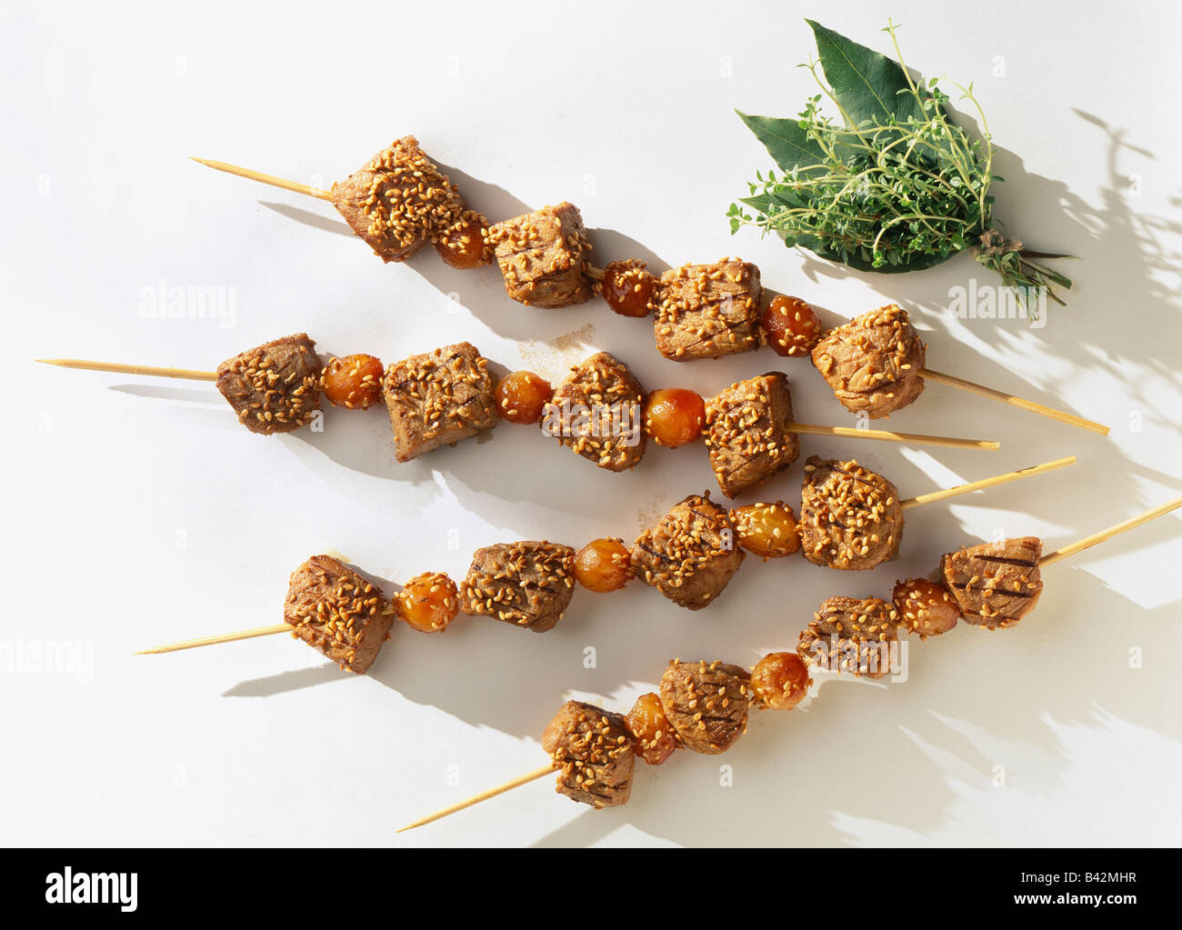 Filet mignon brochettes with sesame seeds Stock Photo - Alamy