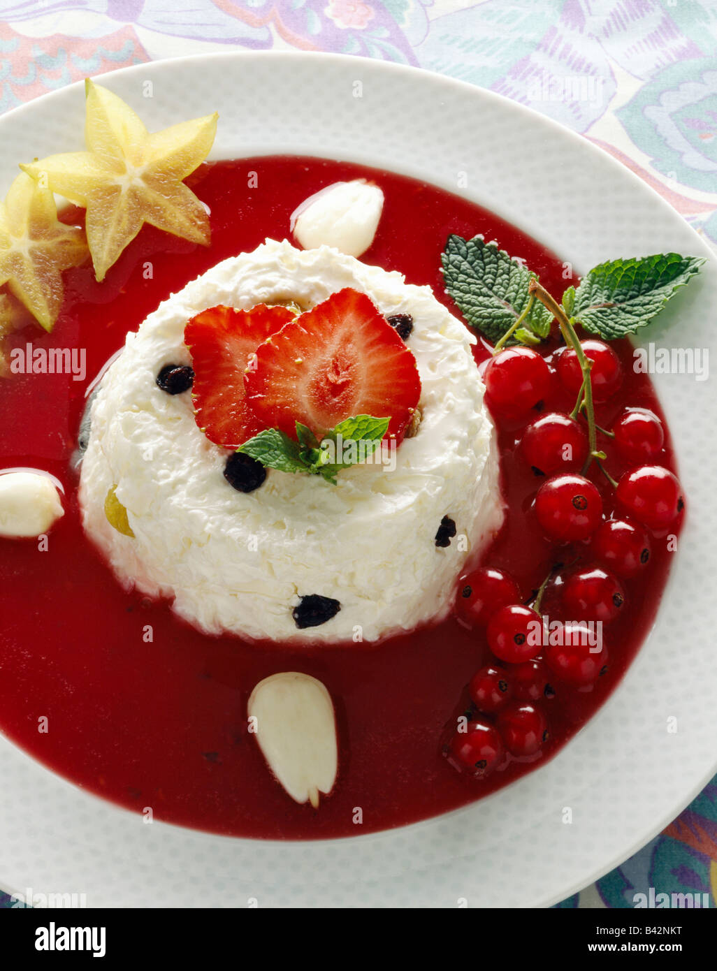 Fromage frais with fruit and summer fruit coulis Stock Photo - Alamy