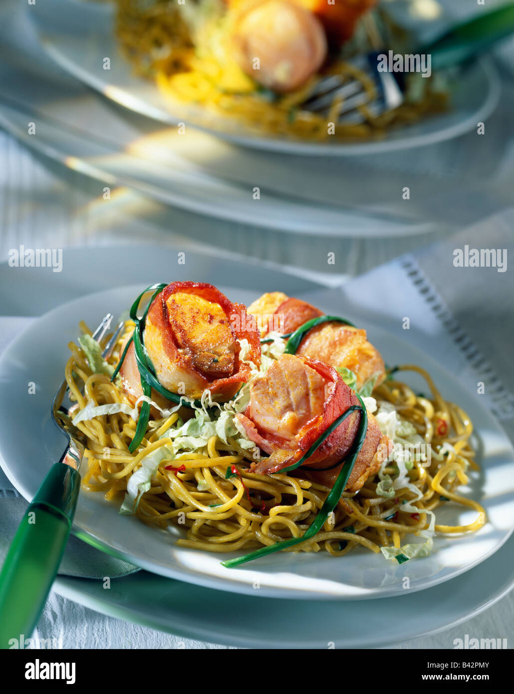 larded salmon paupiette with noodles Stock Photo - Alamy